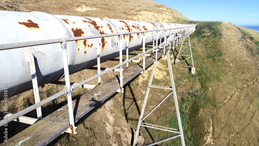 Water Pipeline on pipe bridge traversing over gully in country ...