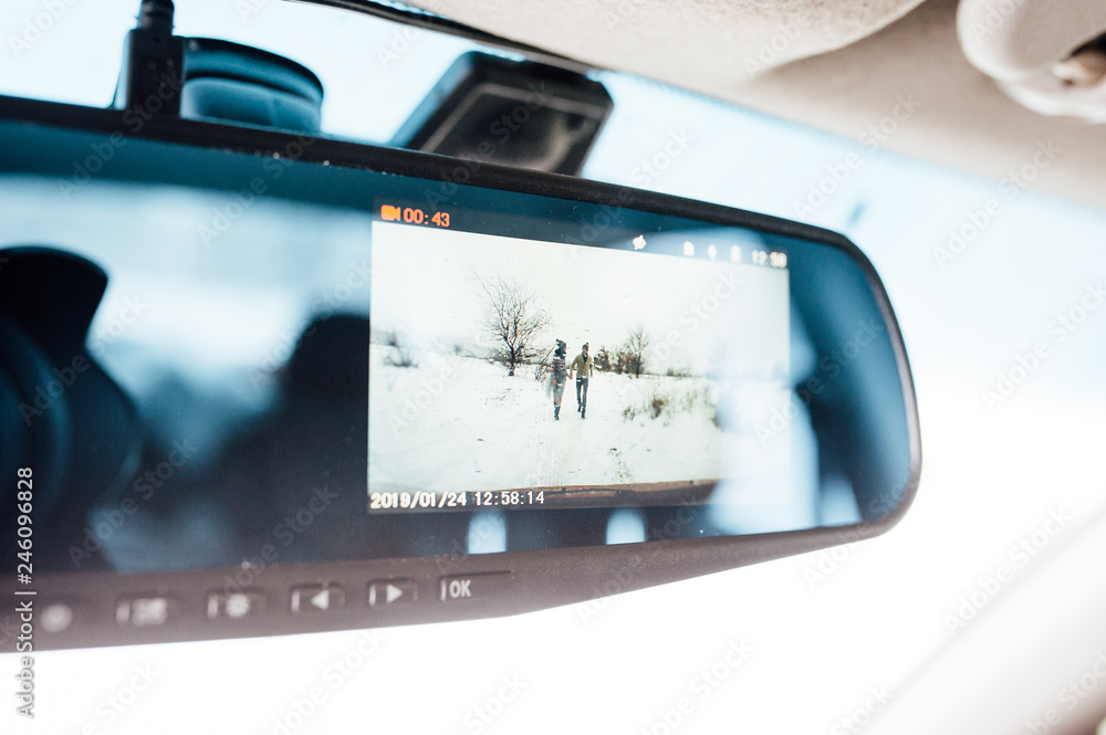 couple running in the snow. view through the screen of the DVR Stock ...