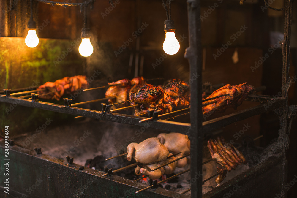 outdoor street chicken barbecue grill with broiler spit roasted over ...