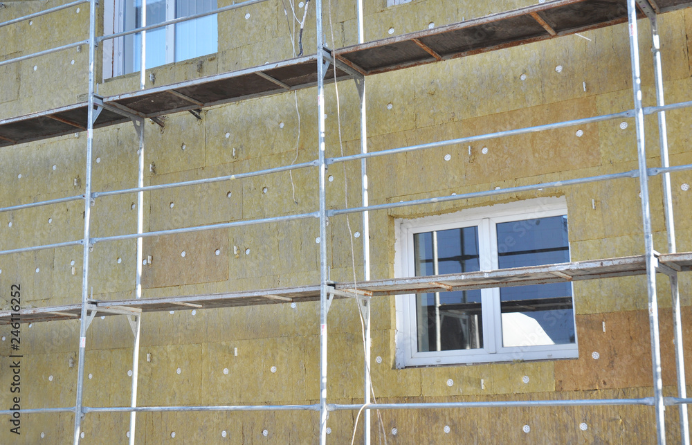 Solid wall insulation with rock wool. Energy efficiency house wall ...