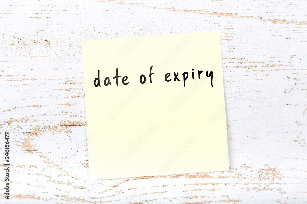 Photo & Art Print Yellow sticky note with handwritten text date of ...