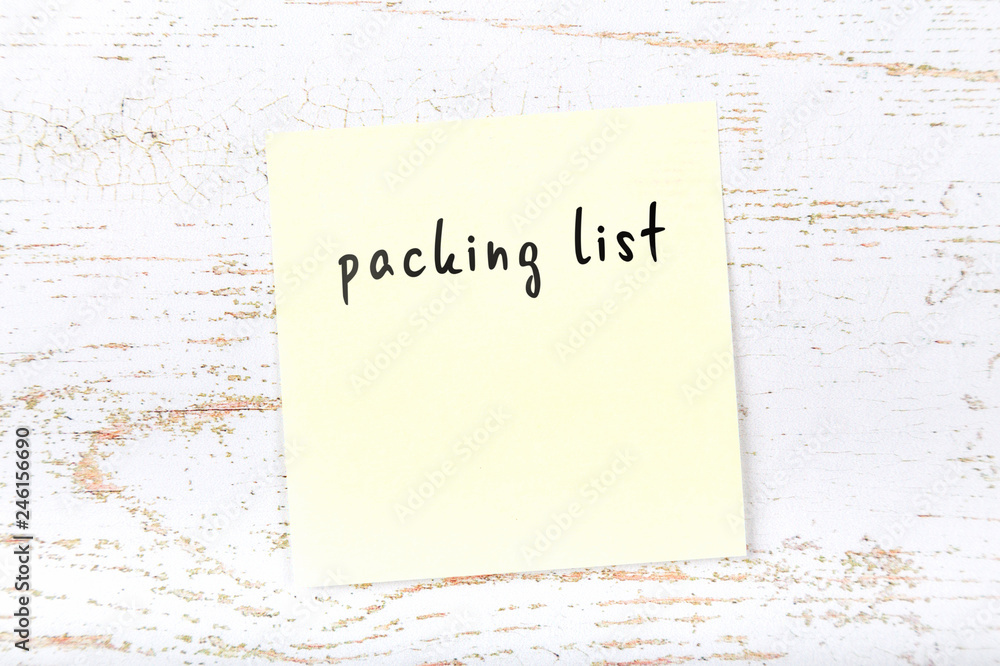 Yellow sticky note with handwritten text packing list Stock Photo ...