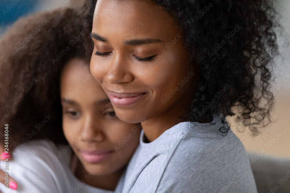 Close Up Of Young Black Mother Hugging Teenage Daughter Fell Love And