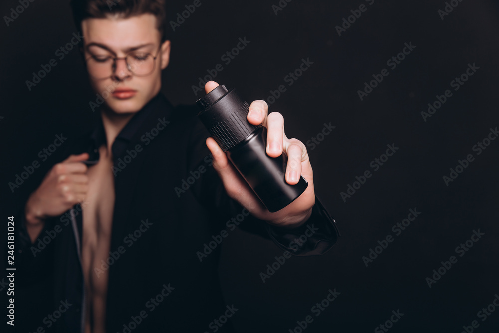 Handsome shirtless man putting deodorant. image of young man using ...