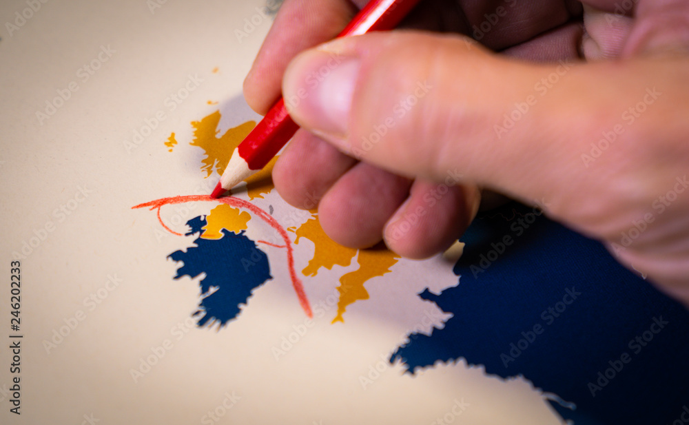Hand drawing a red line between the UK and Northern Ireland, Backstop ...