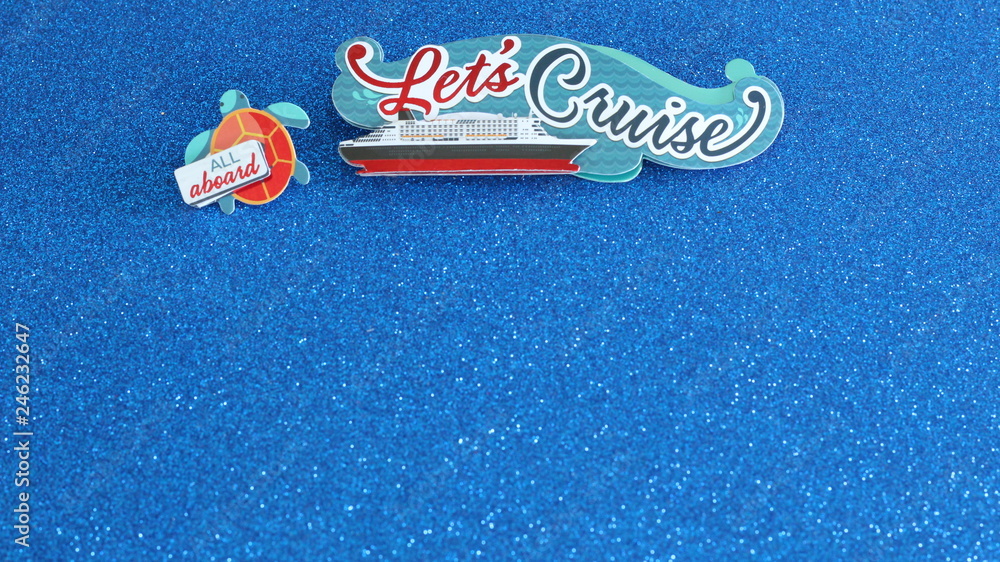 Lets cruise written on a banner with a cruise ship at sea written on a ...