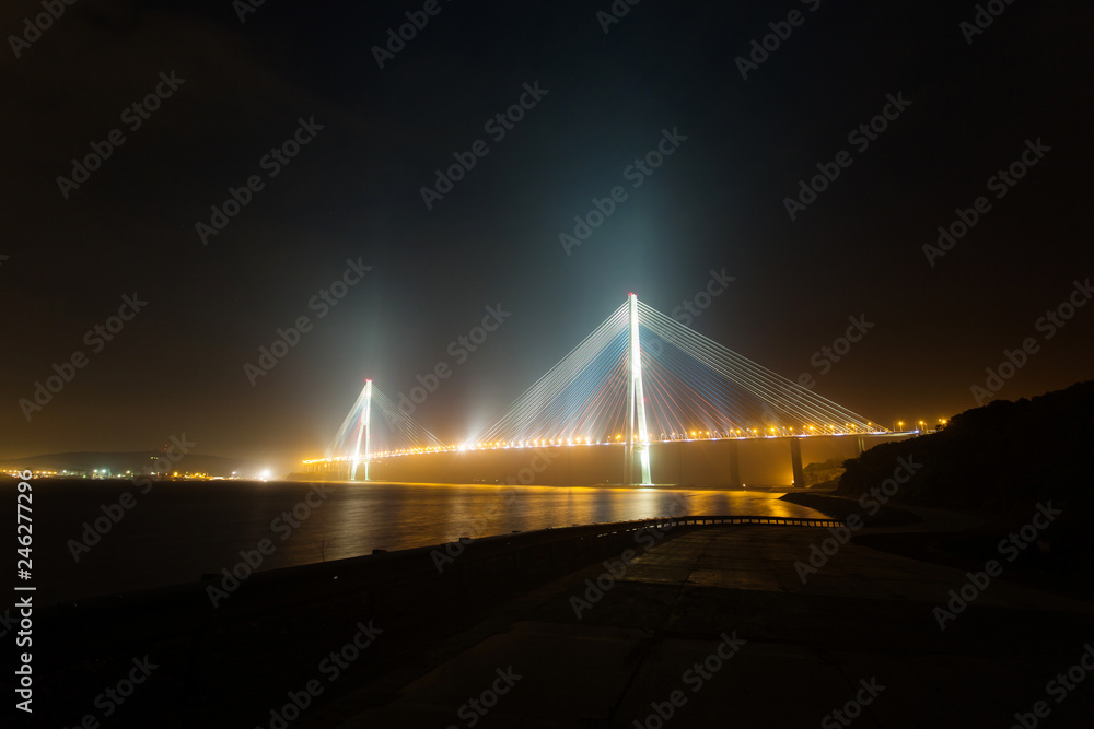Amazing zooming out aerial view of the Russky Bridge, the world's ...