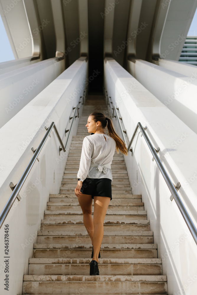 Business Woman Climbing Stairs