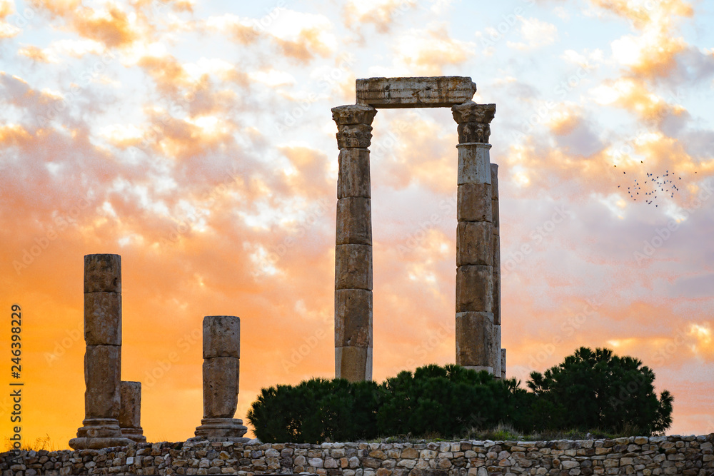 Amazing view of some magnificent columns in the Amman Citadel during a beautiful sunset, Jordan ...