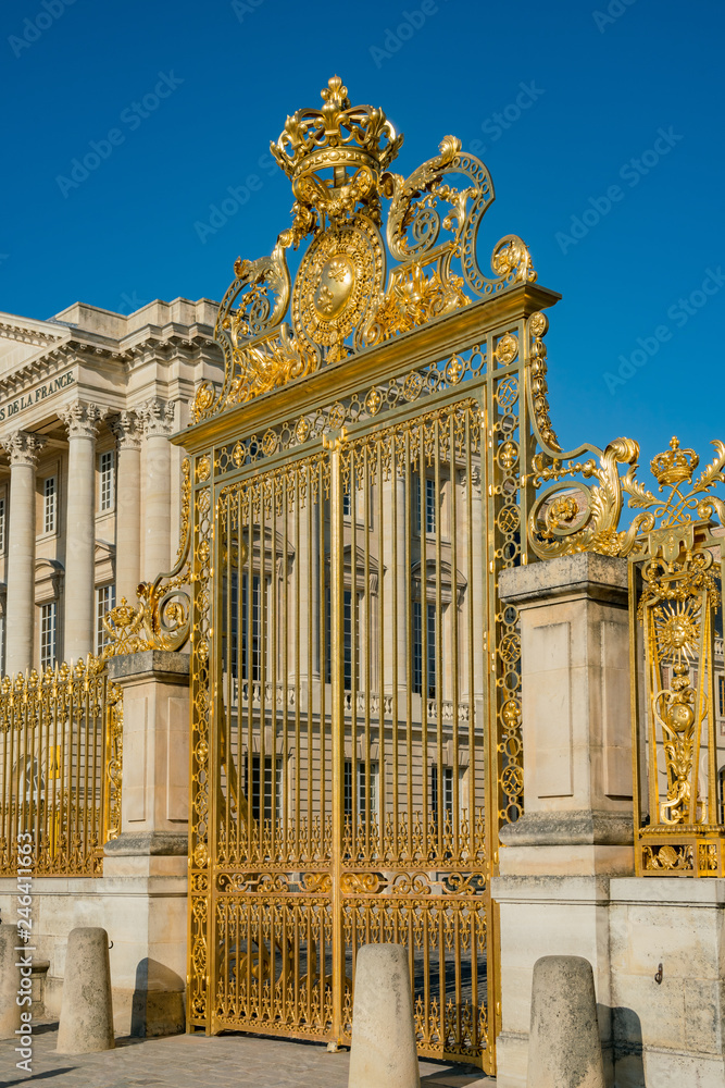 The golden entrance gate of the famous Palace of Versailles Stock Photo ...