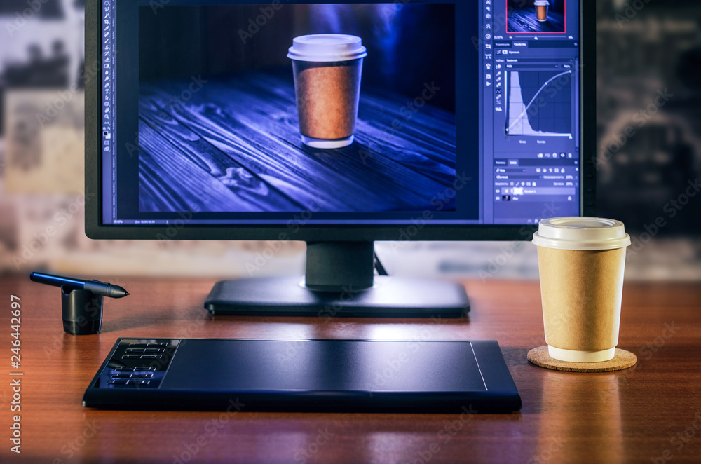 Desktop front view. Computer Graphics Tablet Cup of coffee Hand ...