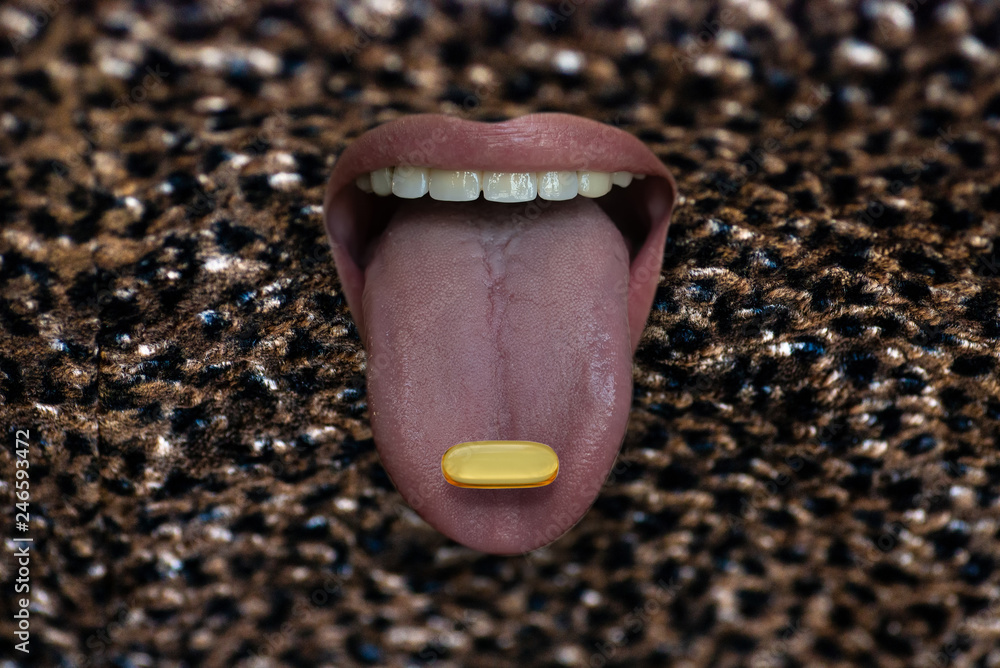 mouth with protruding tongue, on which lies a tablet Stock Photo ...