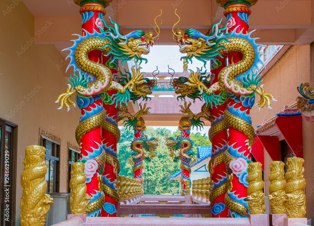 Colorful statue of Chinese dragon wrapped around the pillar. Beautiful ...