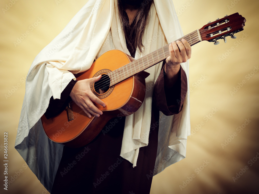 Jesus Christ plays guitar. Stock Photo | Adobe Stock
