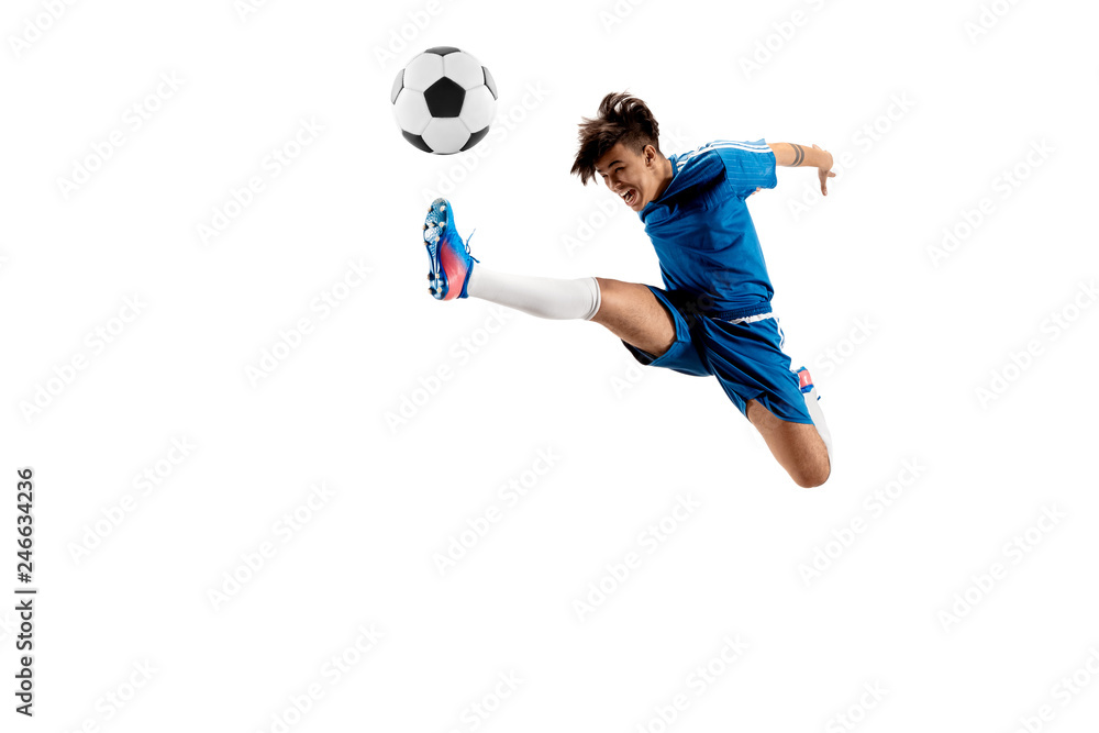 Young boy with soccer ball doing flying kick, isolated on white ...