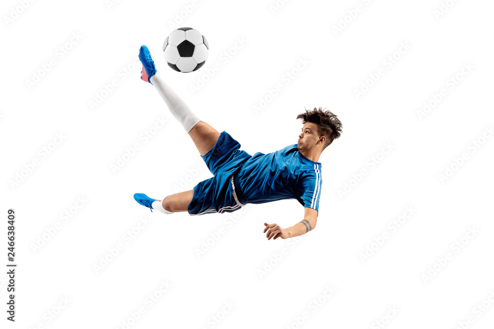 Young boy with soccer ball doing flying kick, isolated on white ...