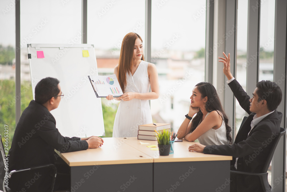 Successful business young woman presenting to employees, business coach ...