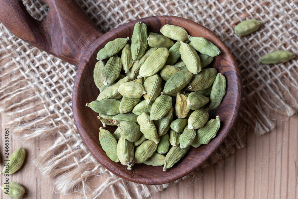 Cardamon seeds on a spoon, top view Stock Photo | Adobe Stock