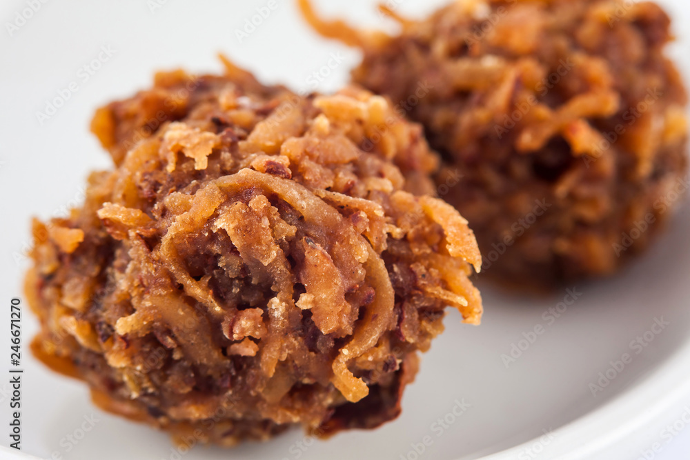 Colombian traditional coconut sweet called cocada in a white ceramic ...