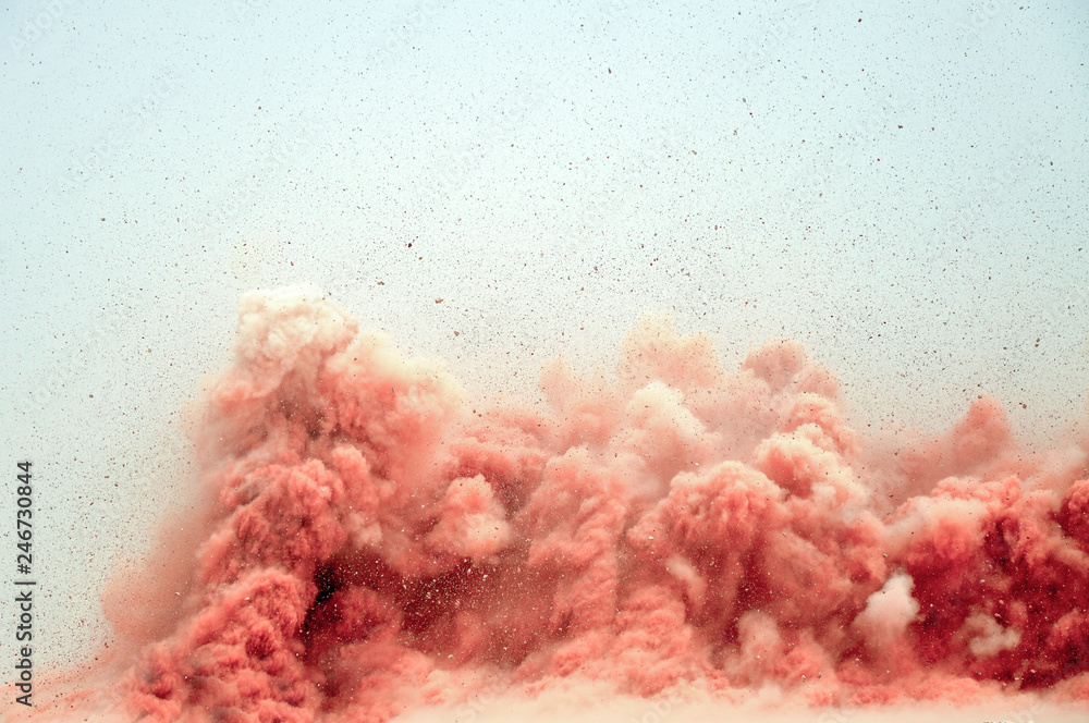 Flying rocks and dust clouds after detonator blast in the desert Stock ...