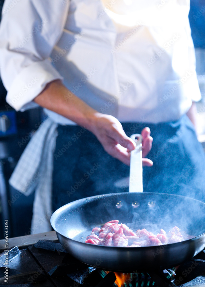 Chef cooking food in the kitchen, Chef preparing food, food frying in ...