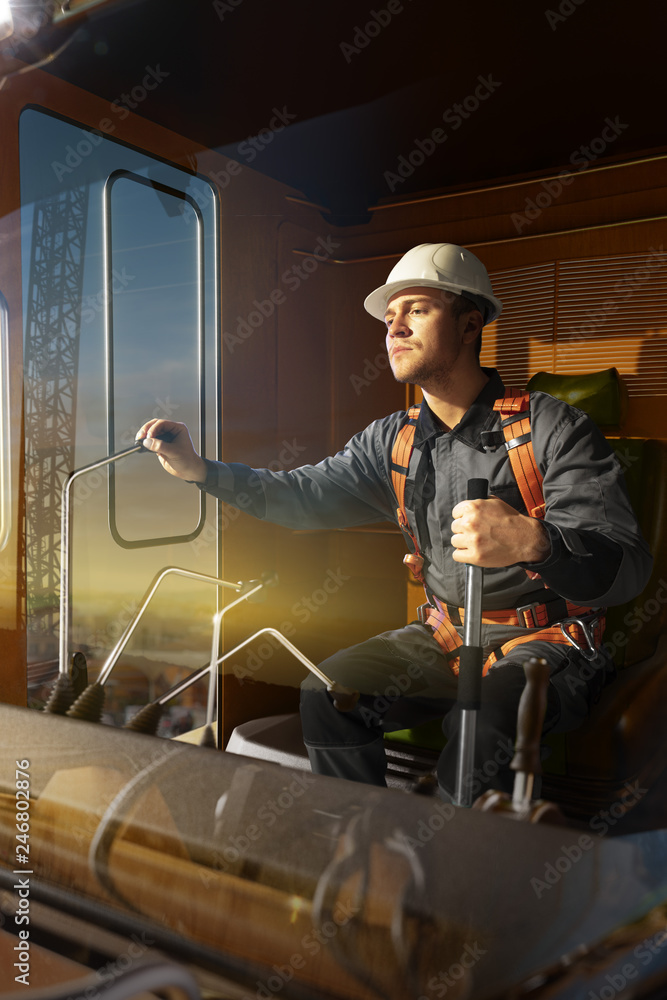 Engineer operator crane in action . He sit a top in crane cabin and ...