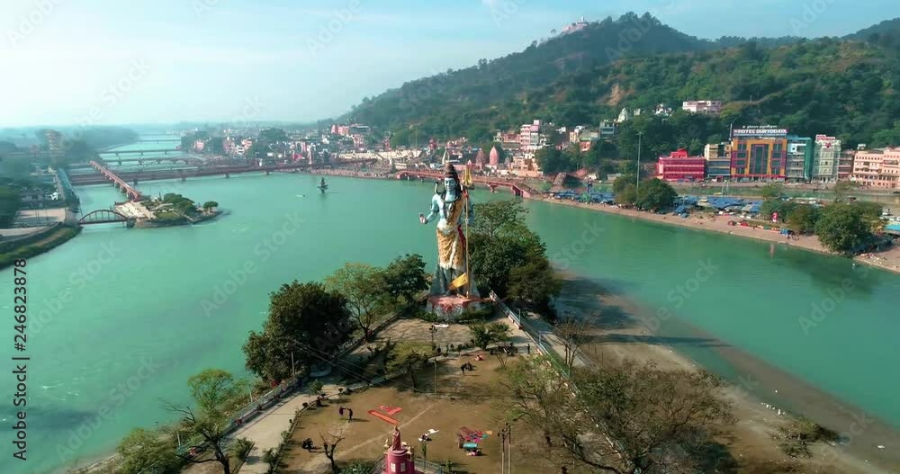 Beautiful side to the front shot of a large statue of the Hindu god ...