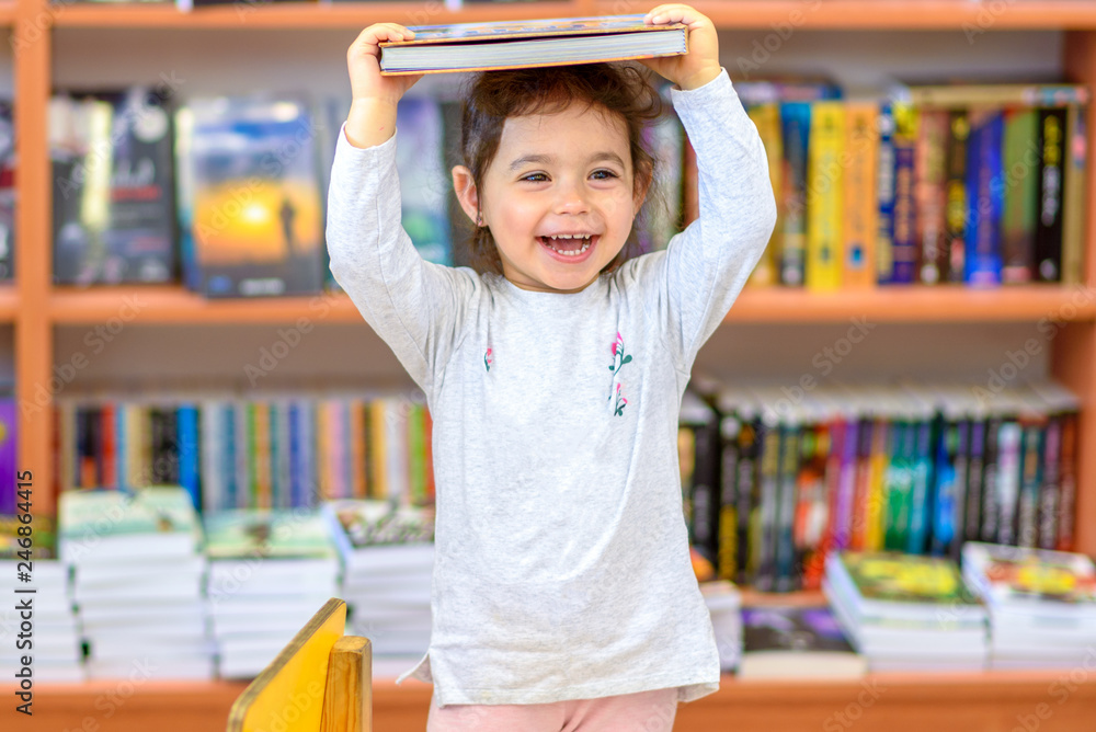 Cute Young Toddler Standing and Holding Book in Head. Little Happy ...