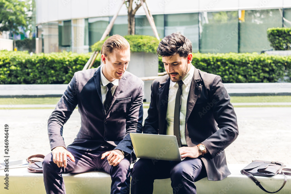 Image two business partners in black elegant suit talking and working ...