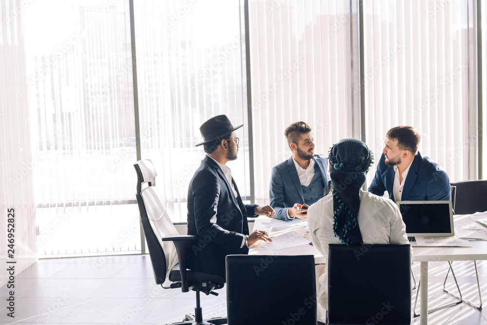Business meeting between multiracial upper management board members in ...