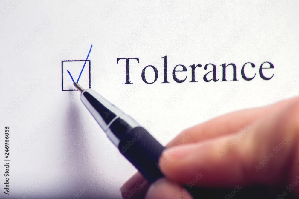Tolerance - checkbox with a cross on white paper with pen. Checklist ...