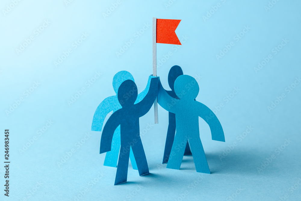 Business team and red flag with goal. The team seeks to achieve the ...