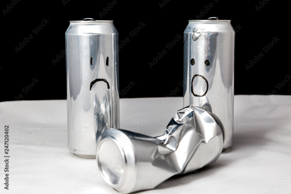 Two saw beaten one. Сrumpled small can. Concept of people emotions ...