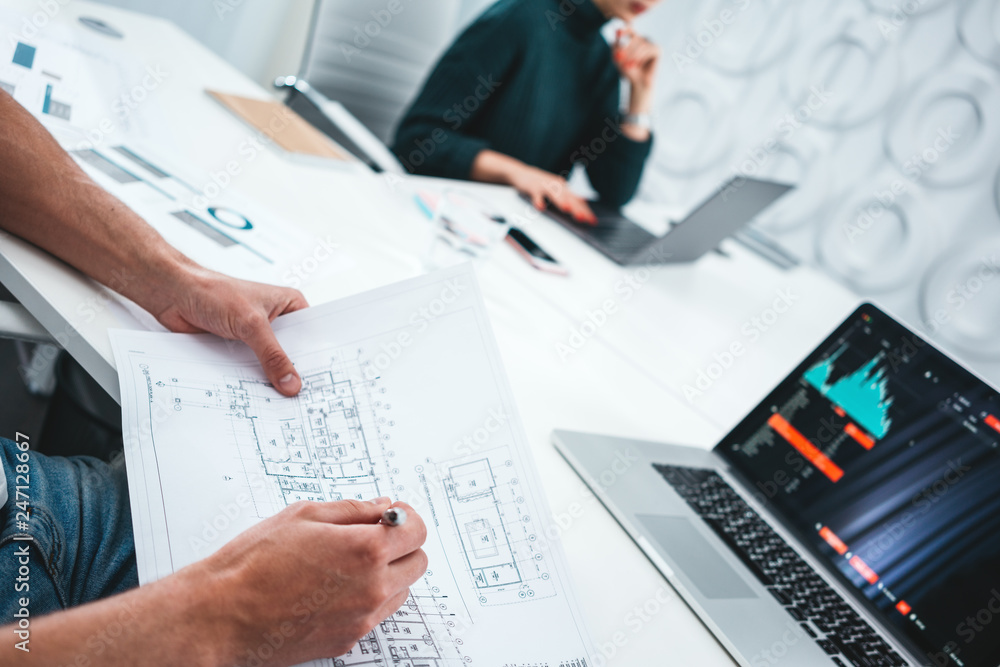 Сolleagues analyze digital reports on screen monitor and preparing ...