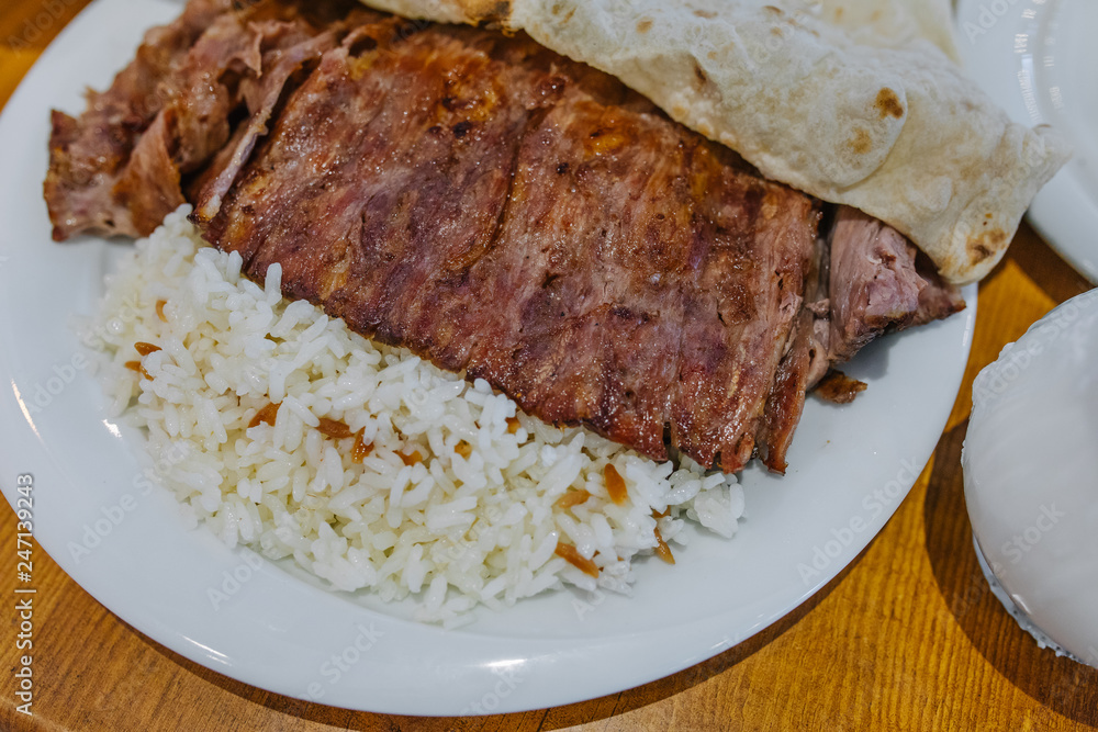 Turkish Doner Kebab, Shawarma or Gyros with rice. Traditional Turkish ...