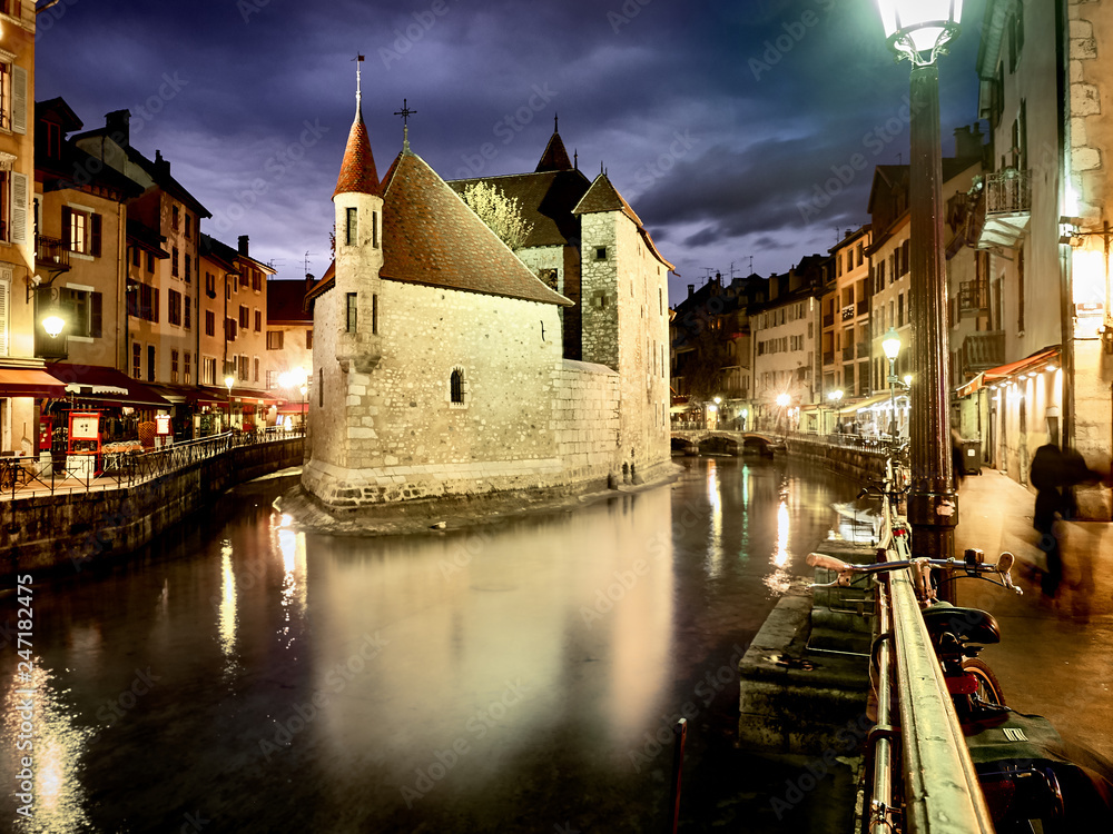 The "Palais de l'Ile" in Annecy, a historical building placed in a ...