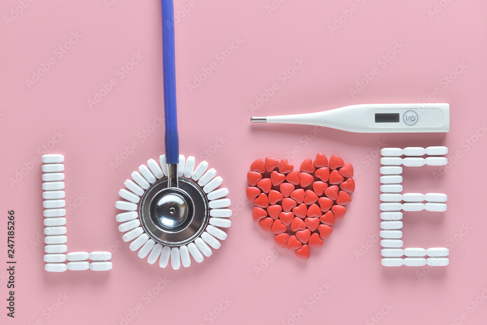 Zdjęcie Stock: LOVE word made from medicine pills, red heart shape and ...