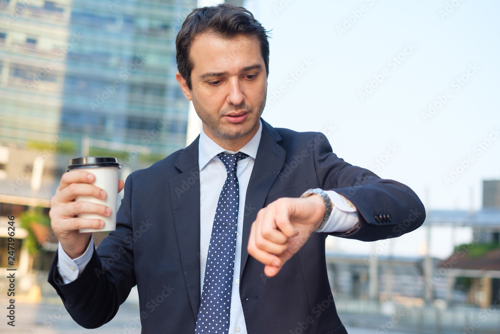 Time is money concept and businessman checking time on his watch Stock ...