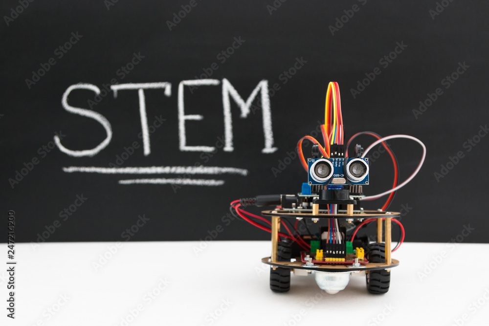 Hand made robot working on the arduino platform. White background. Free ...