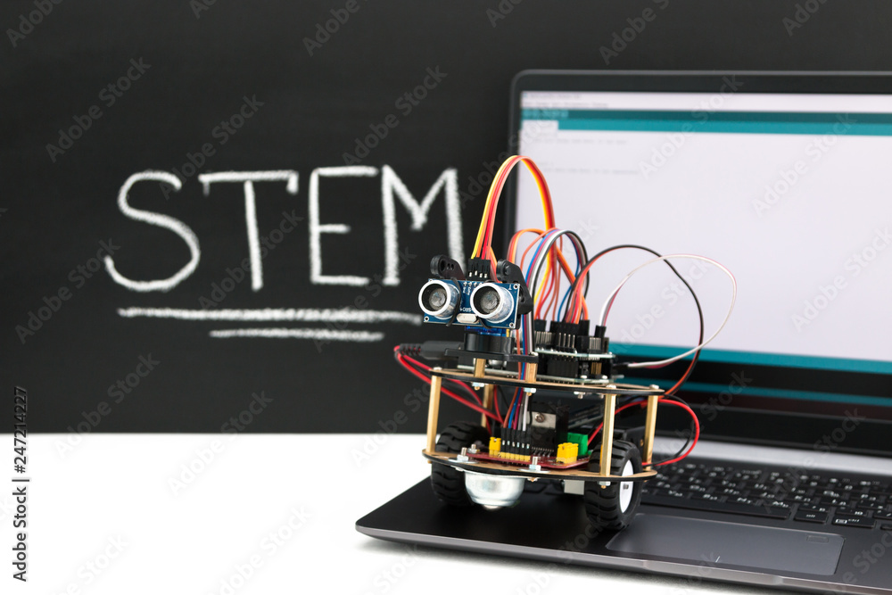 Hand made robot working on the arduino platform. White background. Free ...