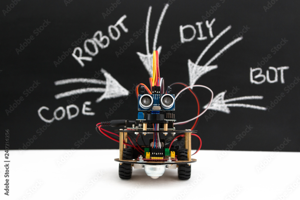 Hand made robot working on the arduino platform. White background. Free ...