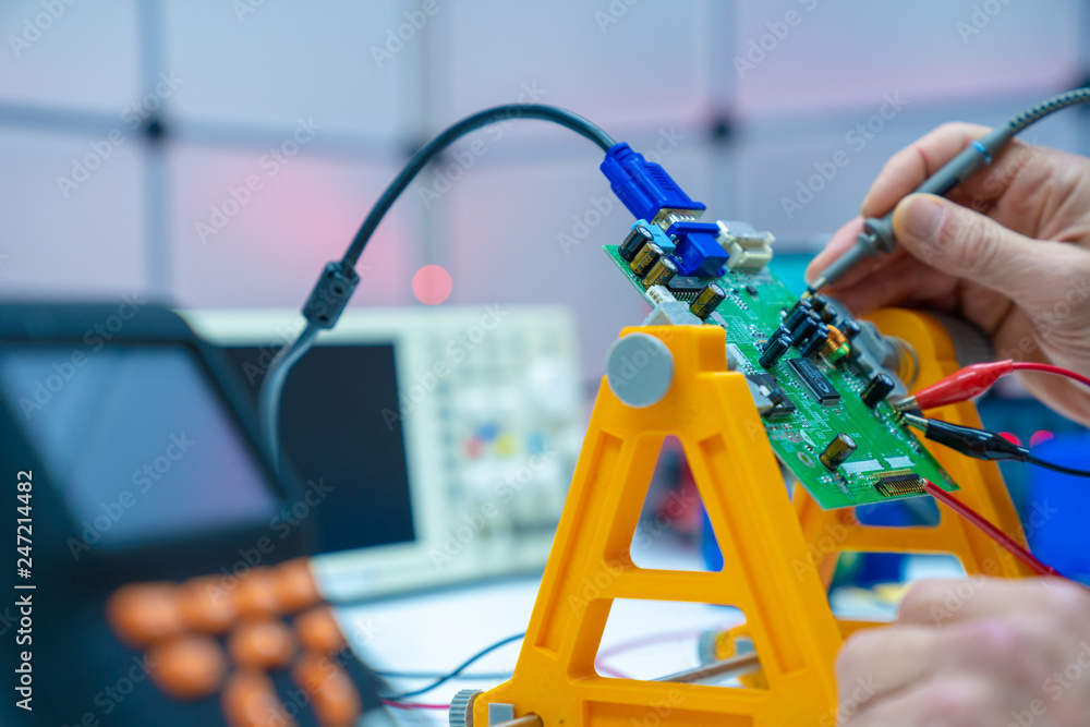 Fixing electronics PCB board in service / workbench with electronics ...