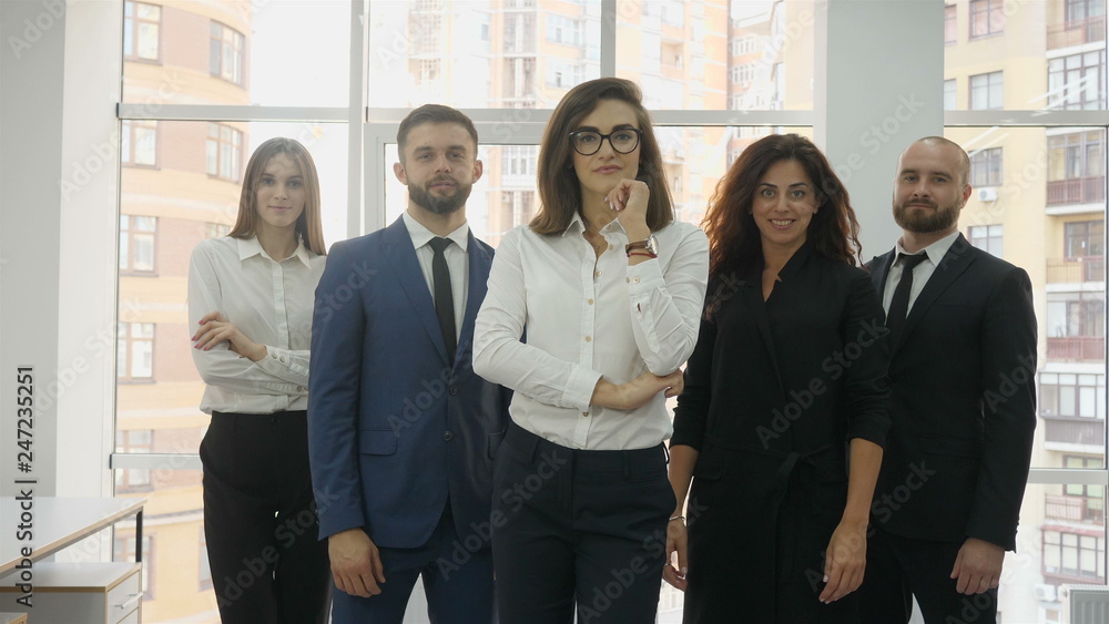 Office workers, two young men and three young women lined up in a pygmy ...