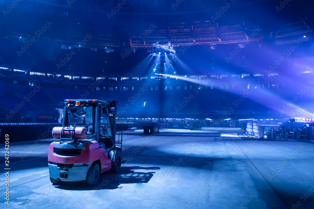 Forklift. Stacker in the spotlight. Production. Loader. Industrial ...
