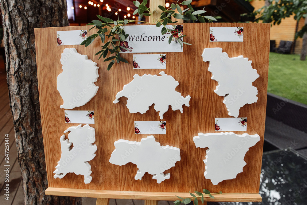 Elements of wedding decor. Invitation wooden board with a seating ...
