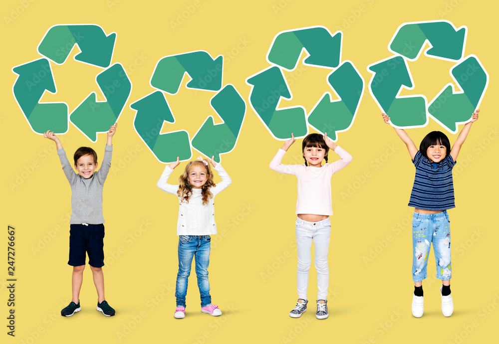 Happy kids holding recycle icons Stock Photo | Adobe Stock