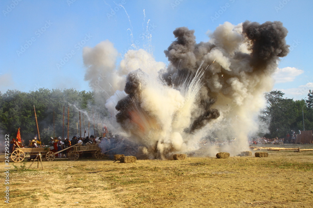 Massive bomb explosion during re-enactment of medieval battle. Blowing ...