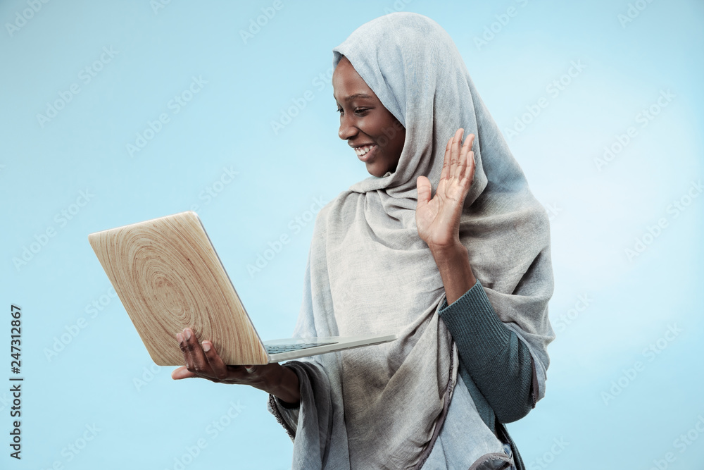 Portrait Of Female University Student Working on laptop. The beautiful ...