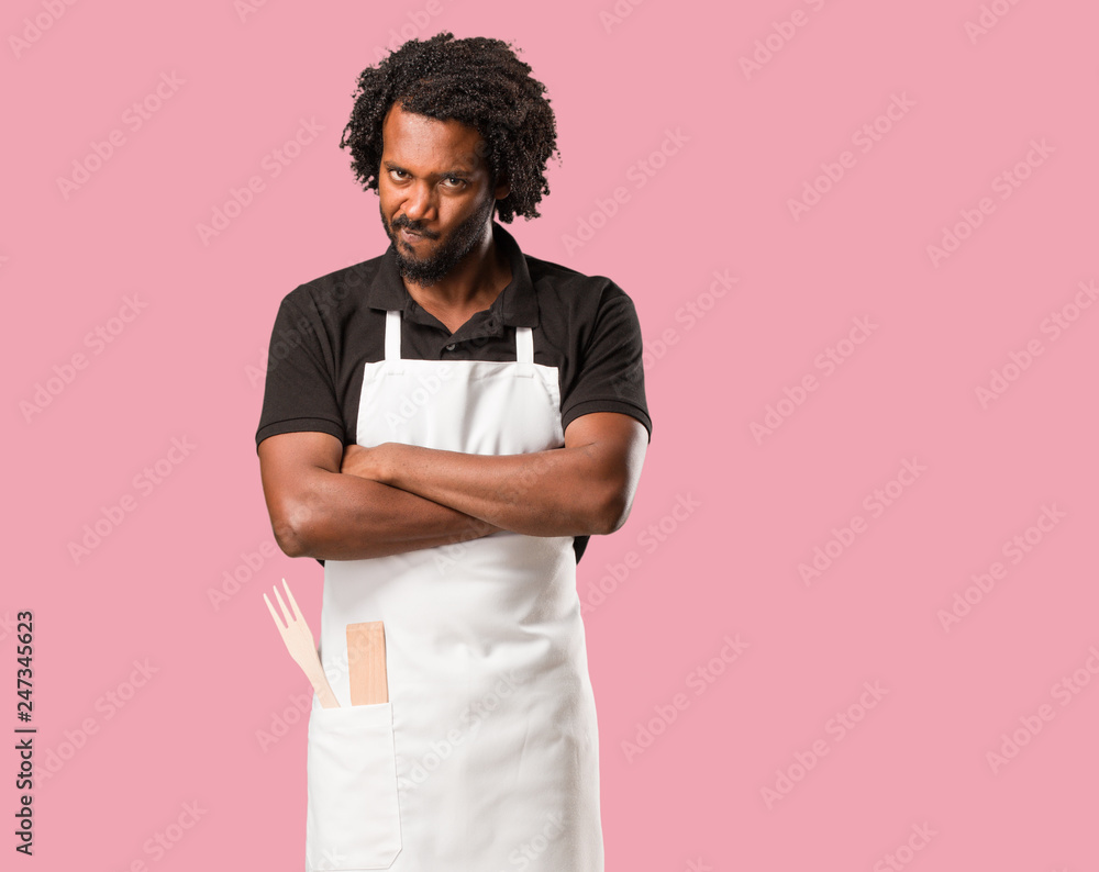 Handsome african american baker very angry and upset, very tense ...