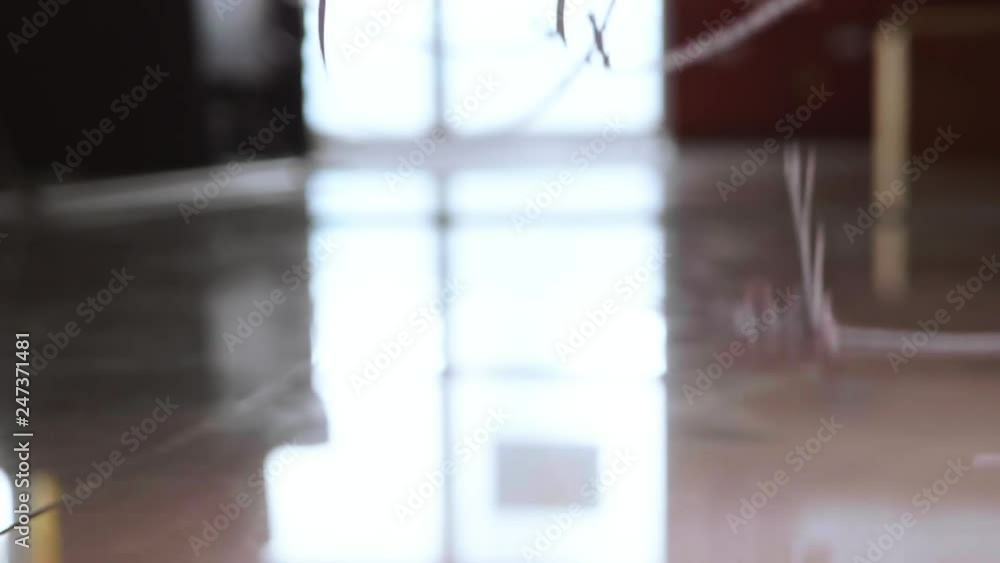 Slow motion of the destroyed paper falling from the top to the ground ...